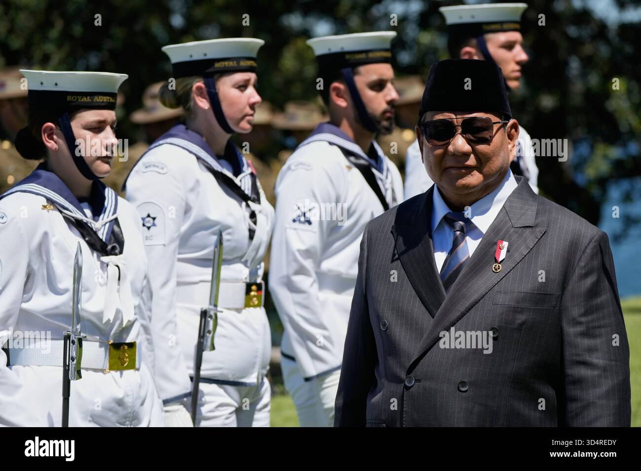 Indonesia's President Prabowo Subianto inspects an honor guard after ...