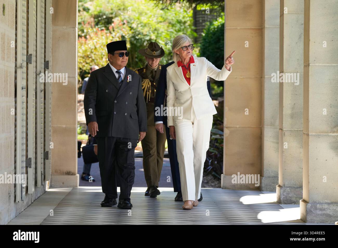Indonesia's President Prabowo Subianto, left, walks with Australia's ...
