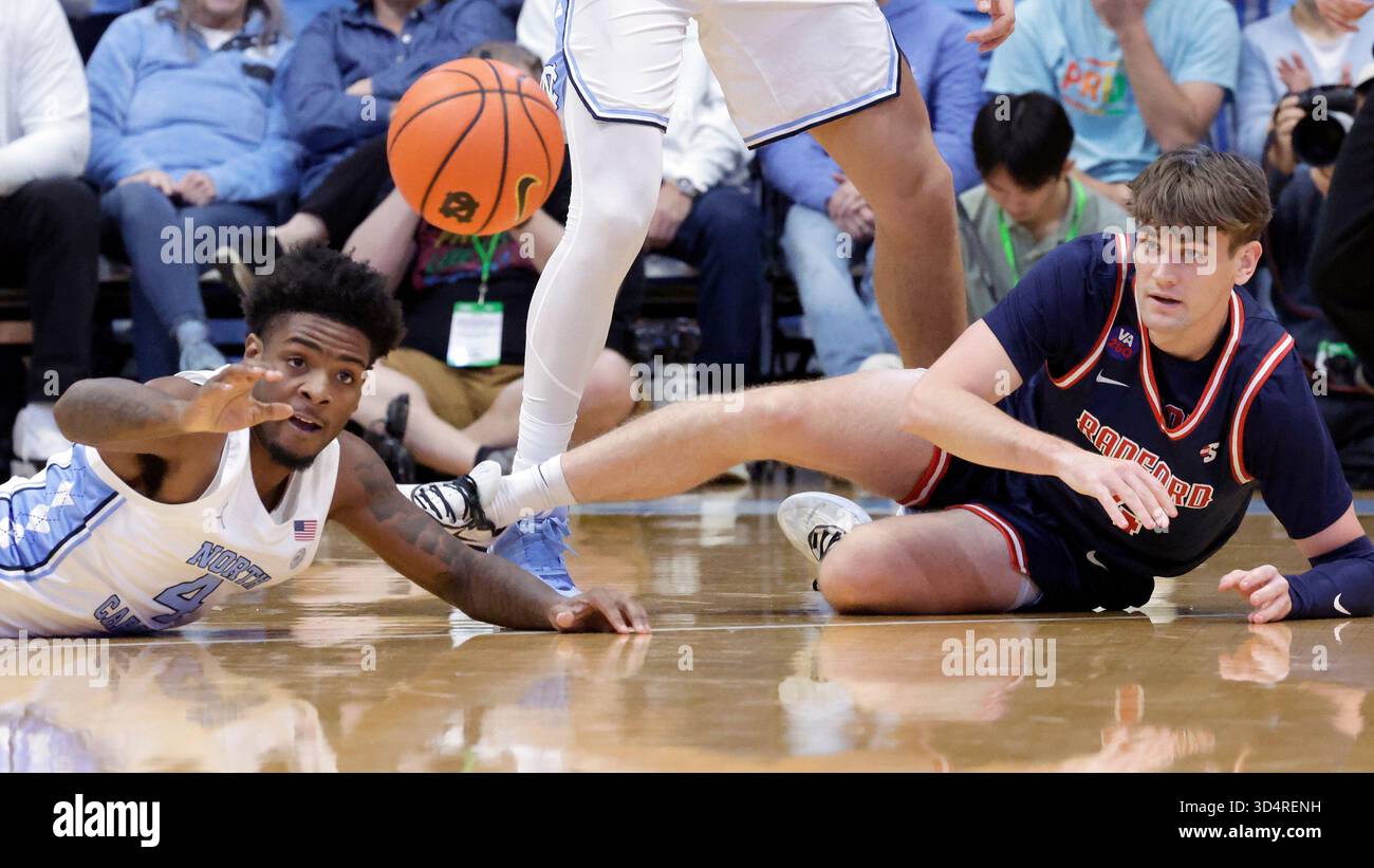 North Carolina guard Jaydon Young (4) and Radford guard Brennan Rigsby ...