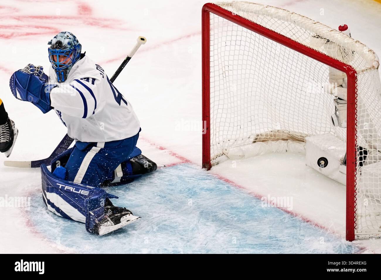 Toronto Maple Leafs goaltender Anthony Stolarz looks back at the puck ...