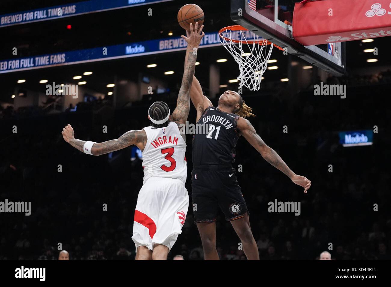 Brooklyn Nets' Noah Clowney (21) shoots over Toronto Raptors' Brandon ...