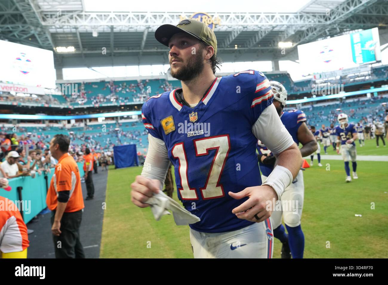 Buffalo Bills quarterback Josh Allen runs off the field following an ...