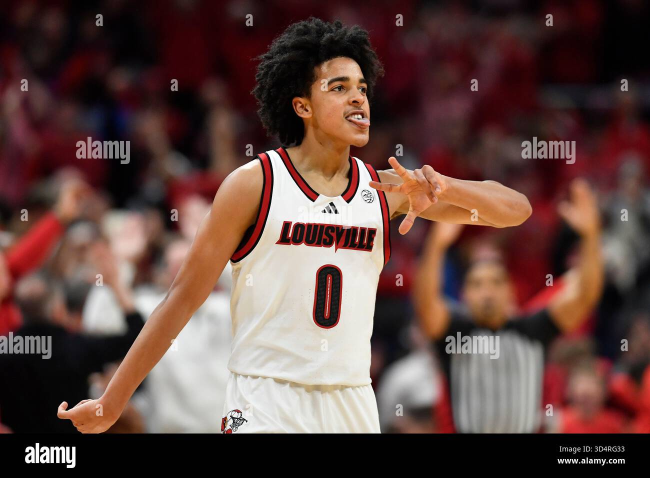 Louisville guard Mikel Brown Jr. (0) holds up three fingers after ...