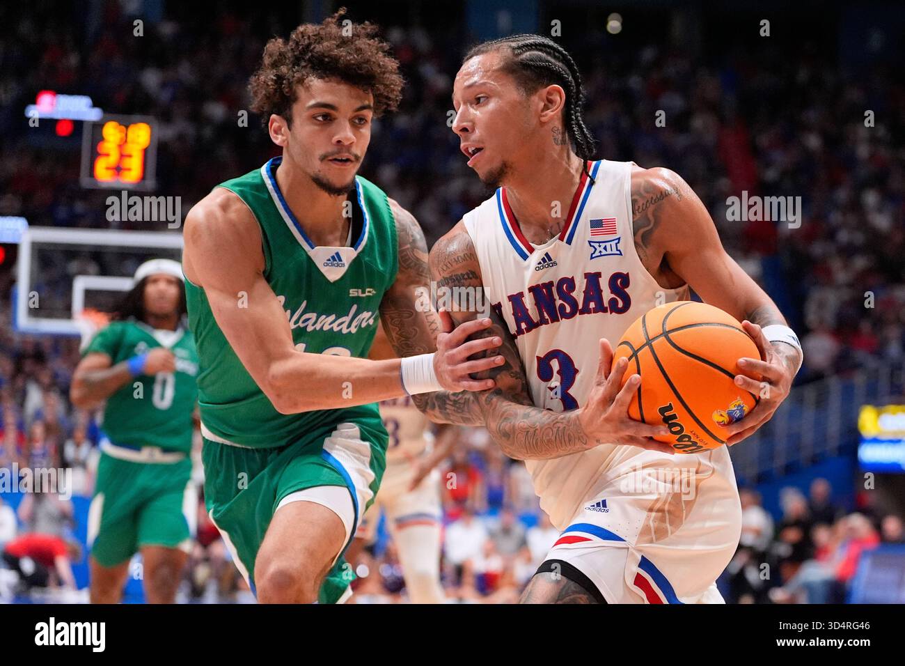 Kansas guard Tre White (3) drives under pressure from Texas A&M Corpus ...