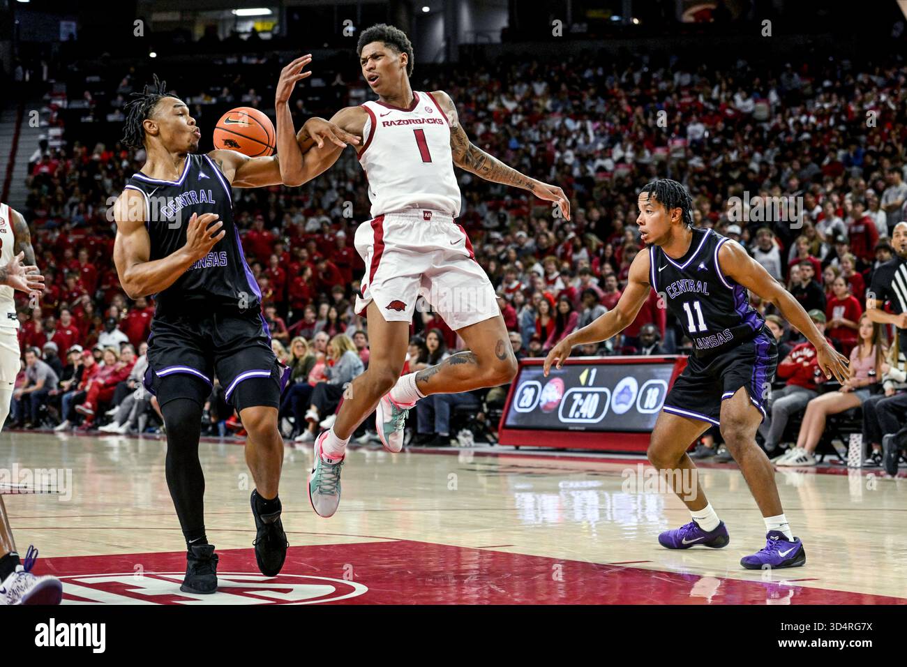 Arkansas guard Meleek Thomas (1) has the ball knocked away as he tries ...