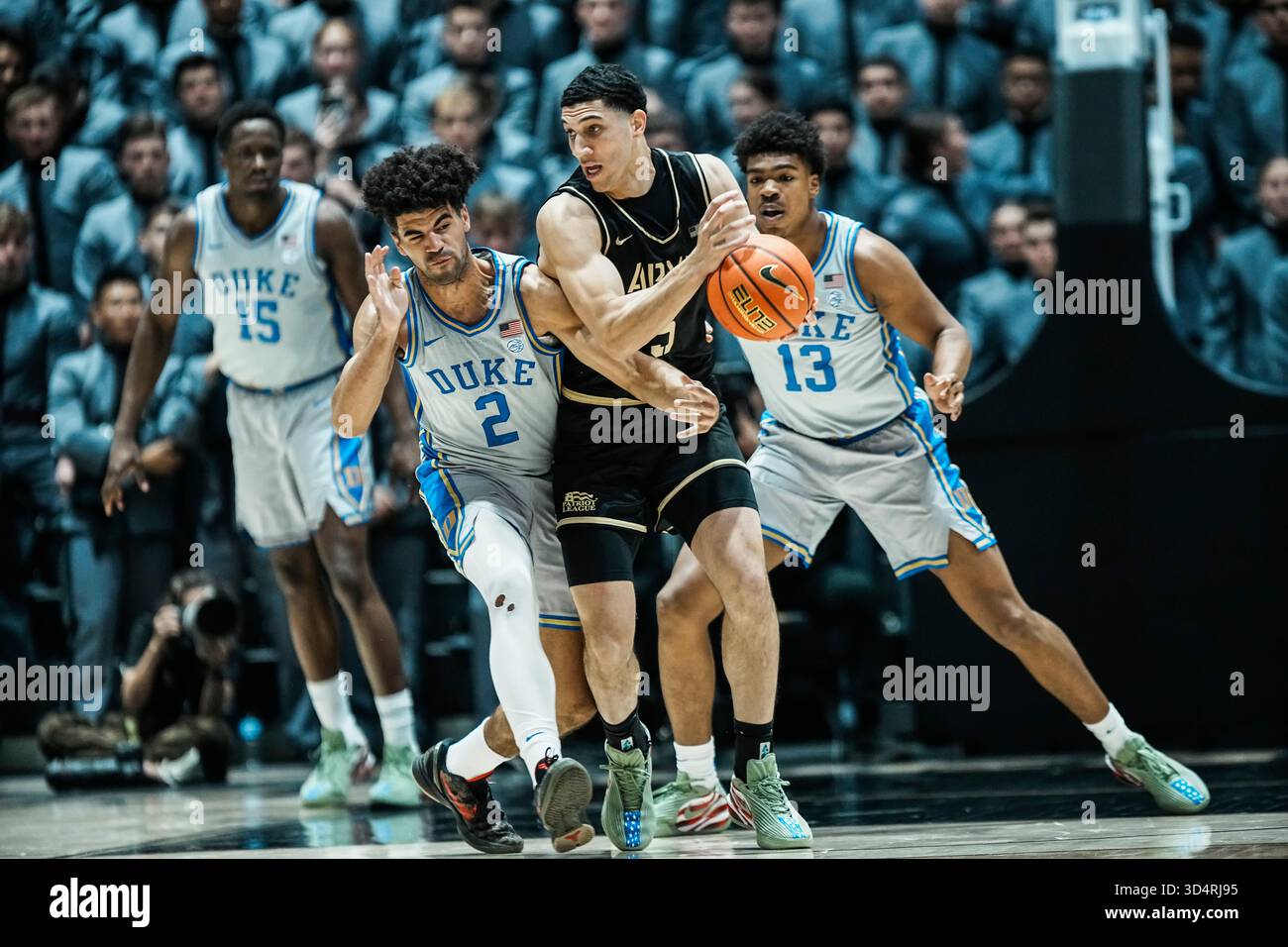 Duke's Cayden Boozer (2) fights for the ball against Army's Joshua Eli ...