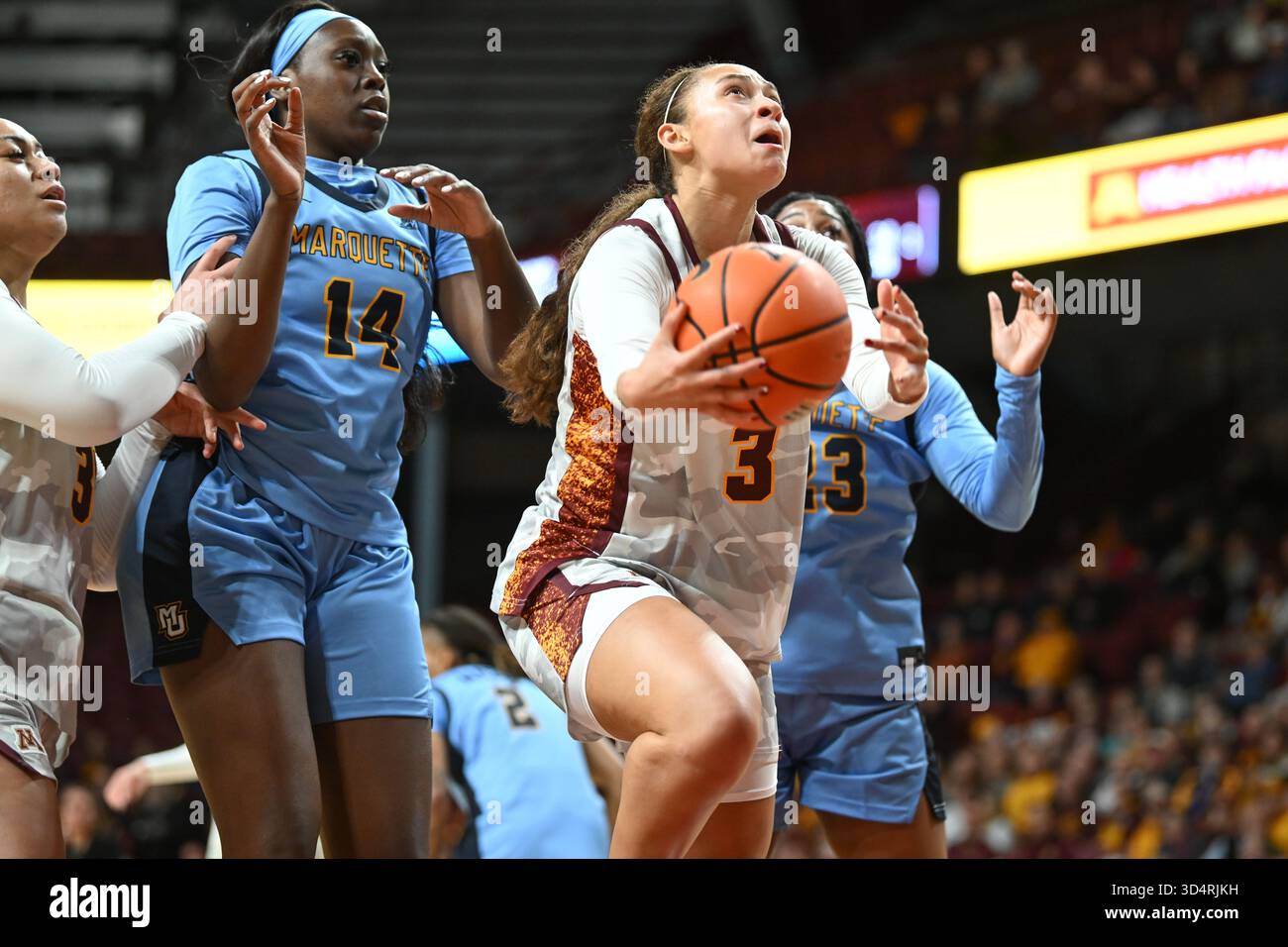 Minnesota guard Amaya Battle (3) drives to the basket past Marquette ...