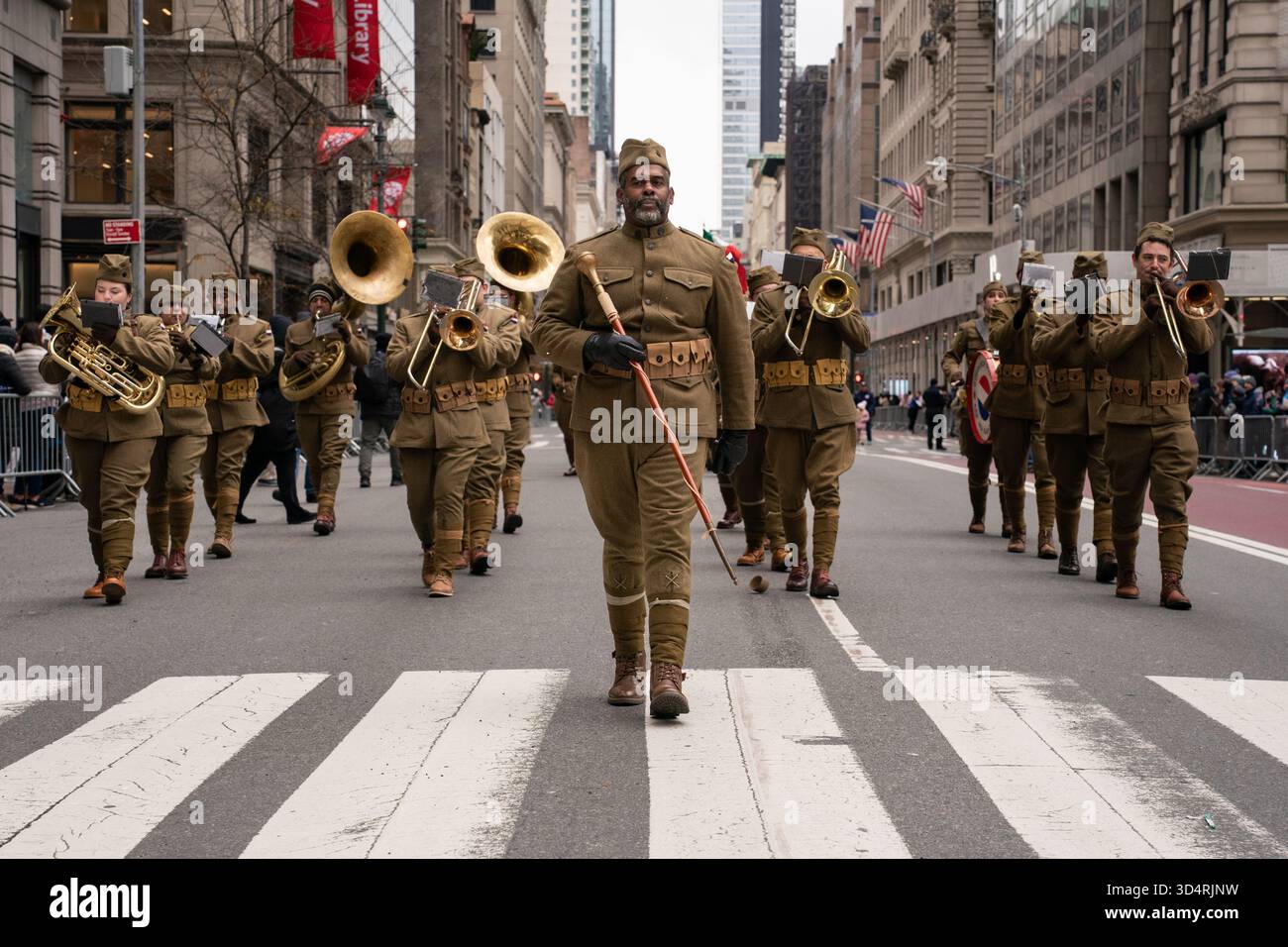 People dressed in American World War I uniforms march during the 106th ...