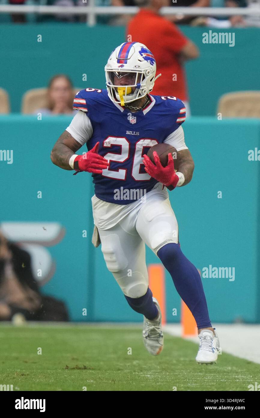 Buffalo Bills running back Ty Johnson (26) runs after a catch during an ...
