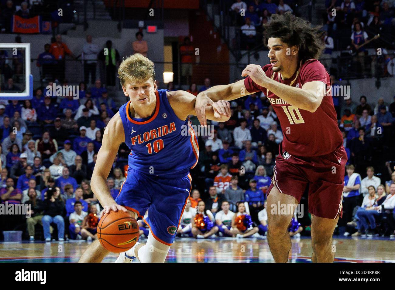 Florida forward Thomas Haugh (10) drives past Florida State guard Lajae ...