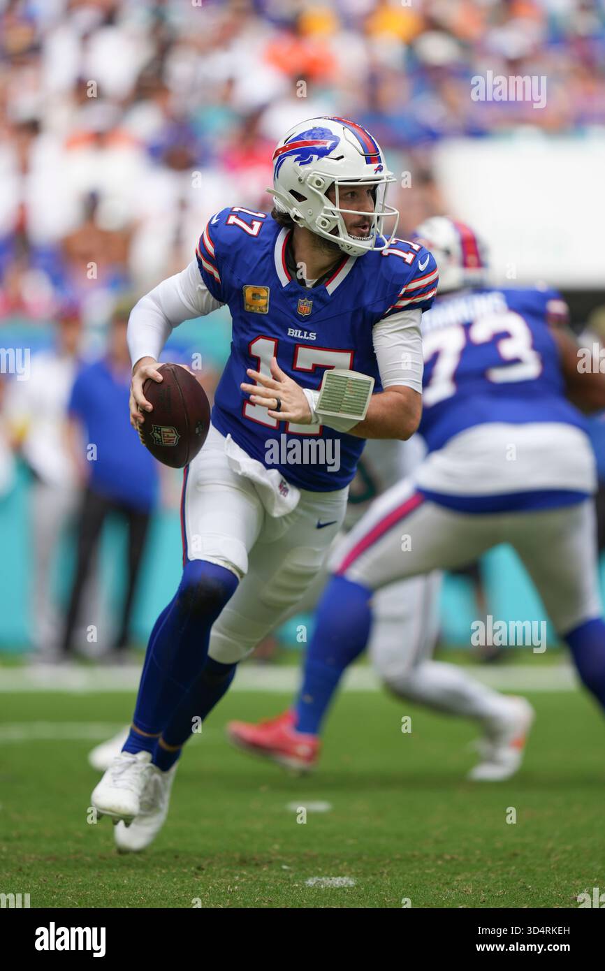Buffalo Bills quarterback Josh Allen (17) scrambles behind the line of ...