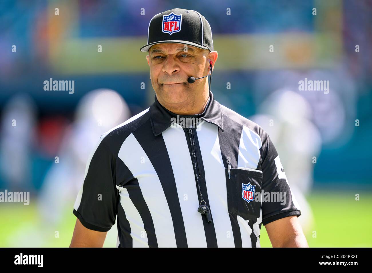 NFL down judge Frank LeBlanc stands on the field before an NFL football ...