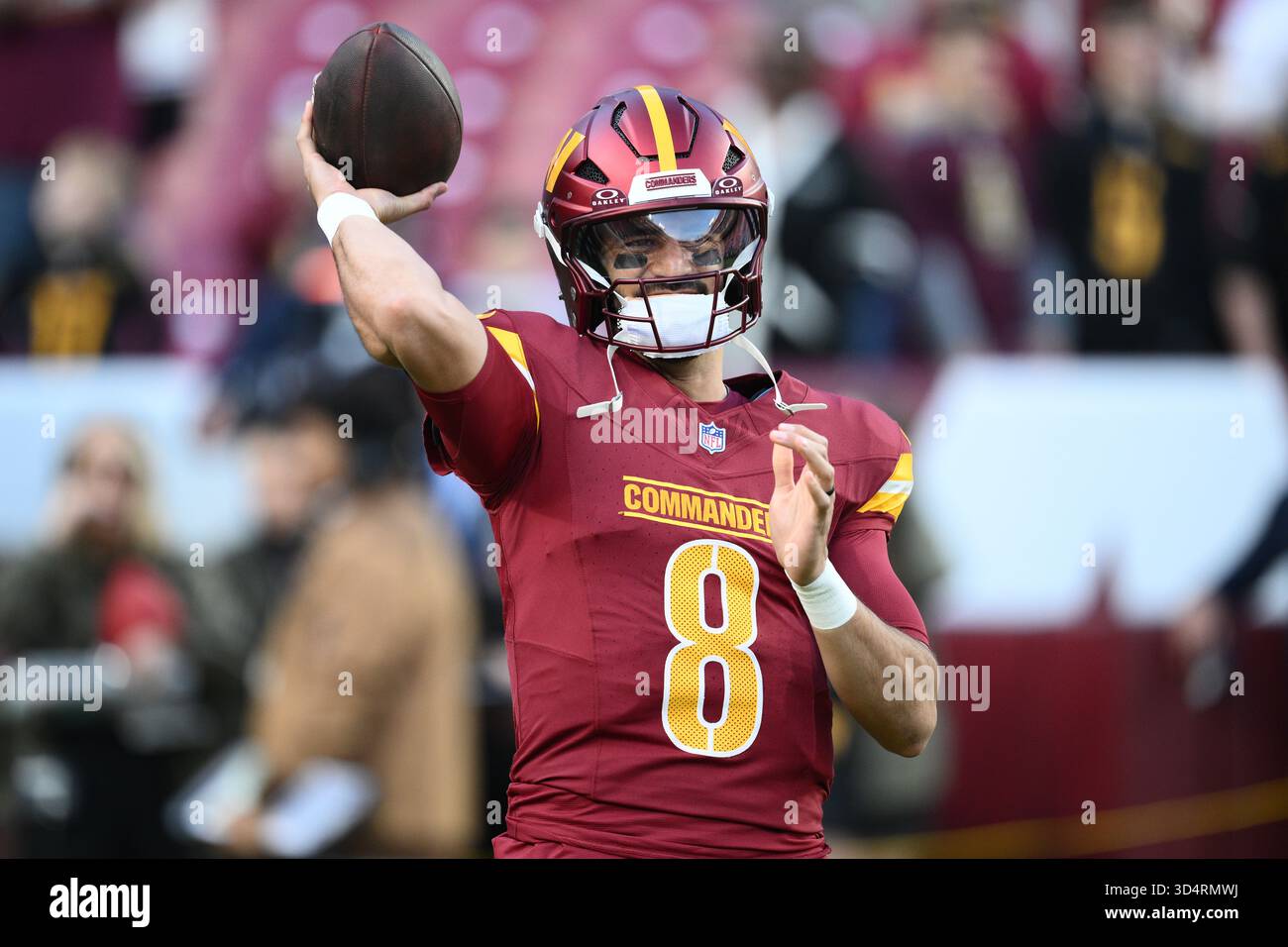 Washington Commanders quarterback Marcus Mariota (8) warms up before an ...
