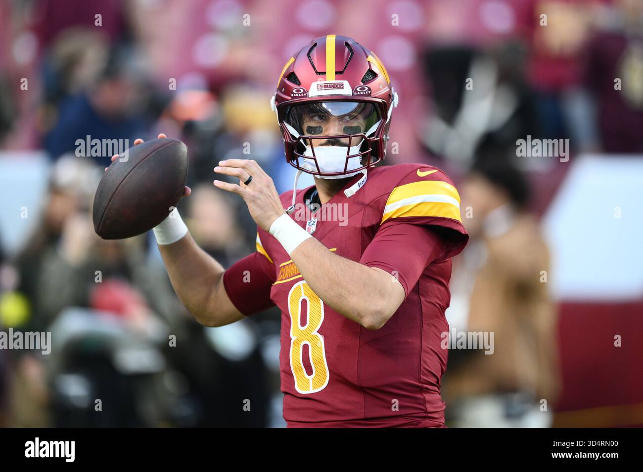 Washington Commanders quarterback Marcus Mariota (8) warms up before an ...