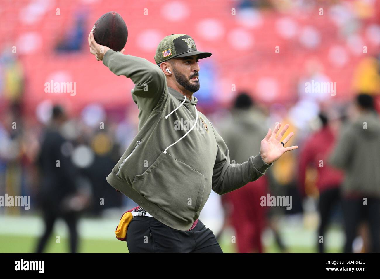 Washington Commanders quarterback Marcus Mariota (8) warms up before an ...