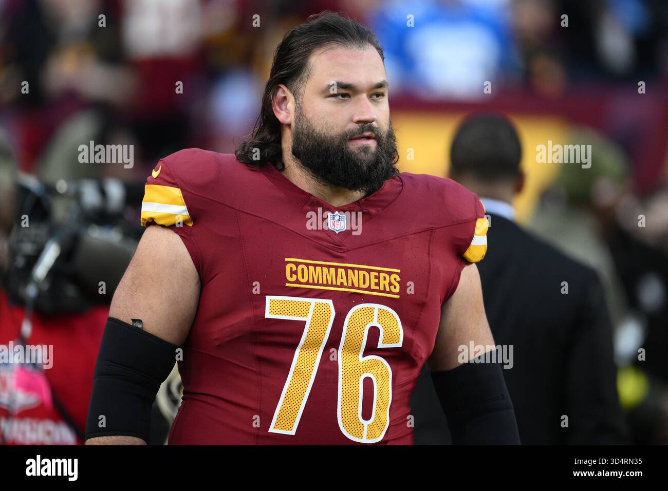 Washington Commanders guard Sam Cosmi (76) warms up before an NFL ...