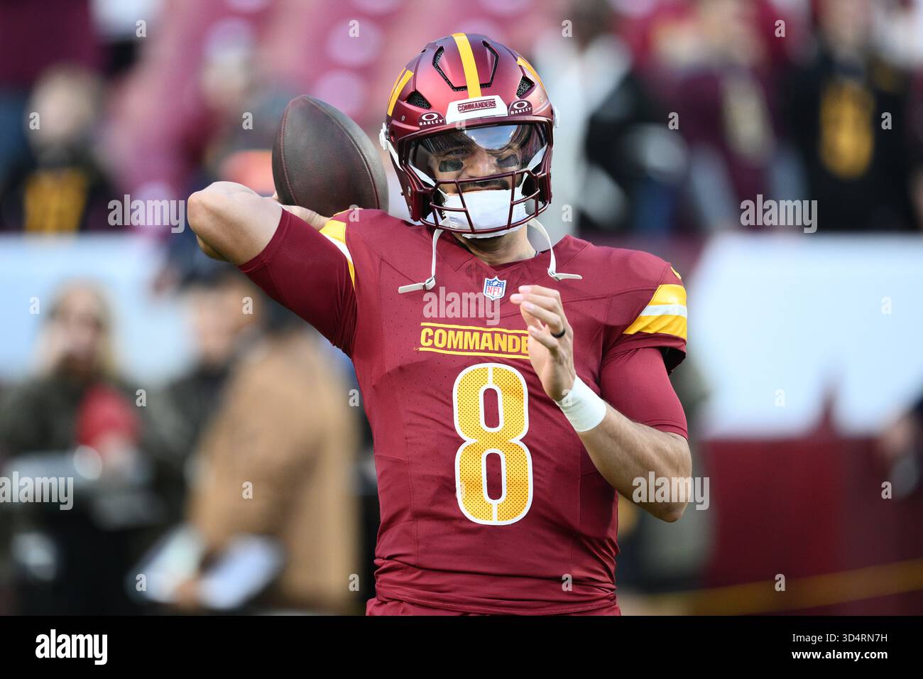 Washington Commanders quarterback Marcus Mariota (8) warms up before an ...