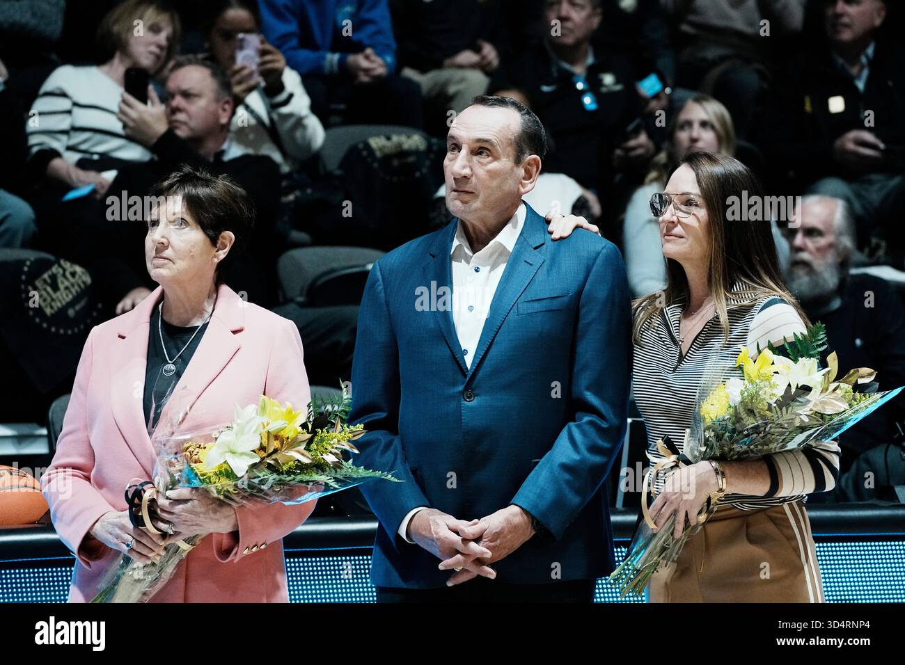Former Duke coach Mike Krzyzewski, center, looks at a video during a ...