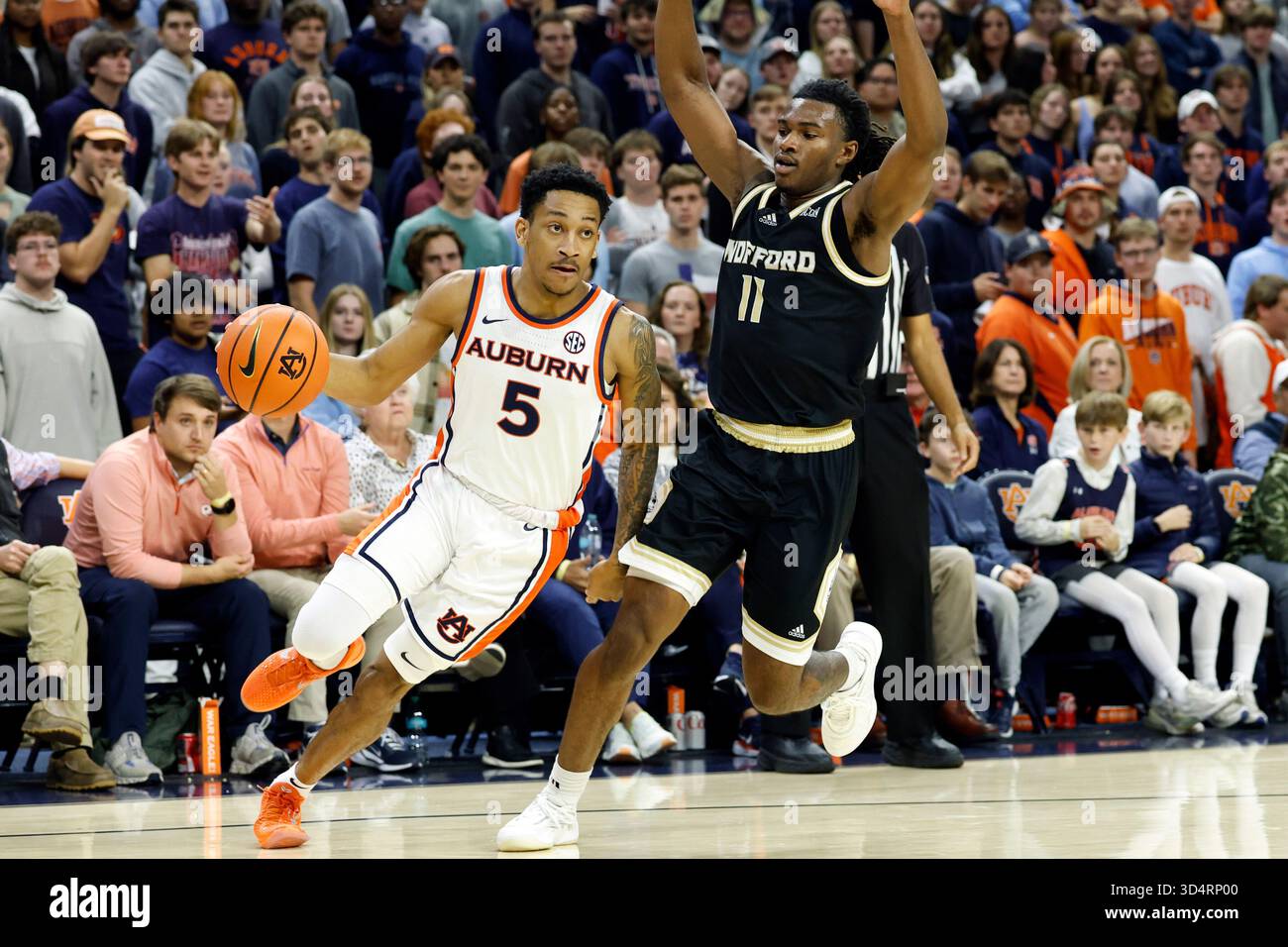 Auburn guard Kaden Magwood (5) dribbles around Wofford guard Kahmare ...
