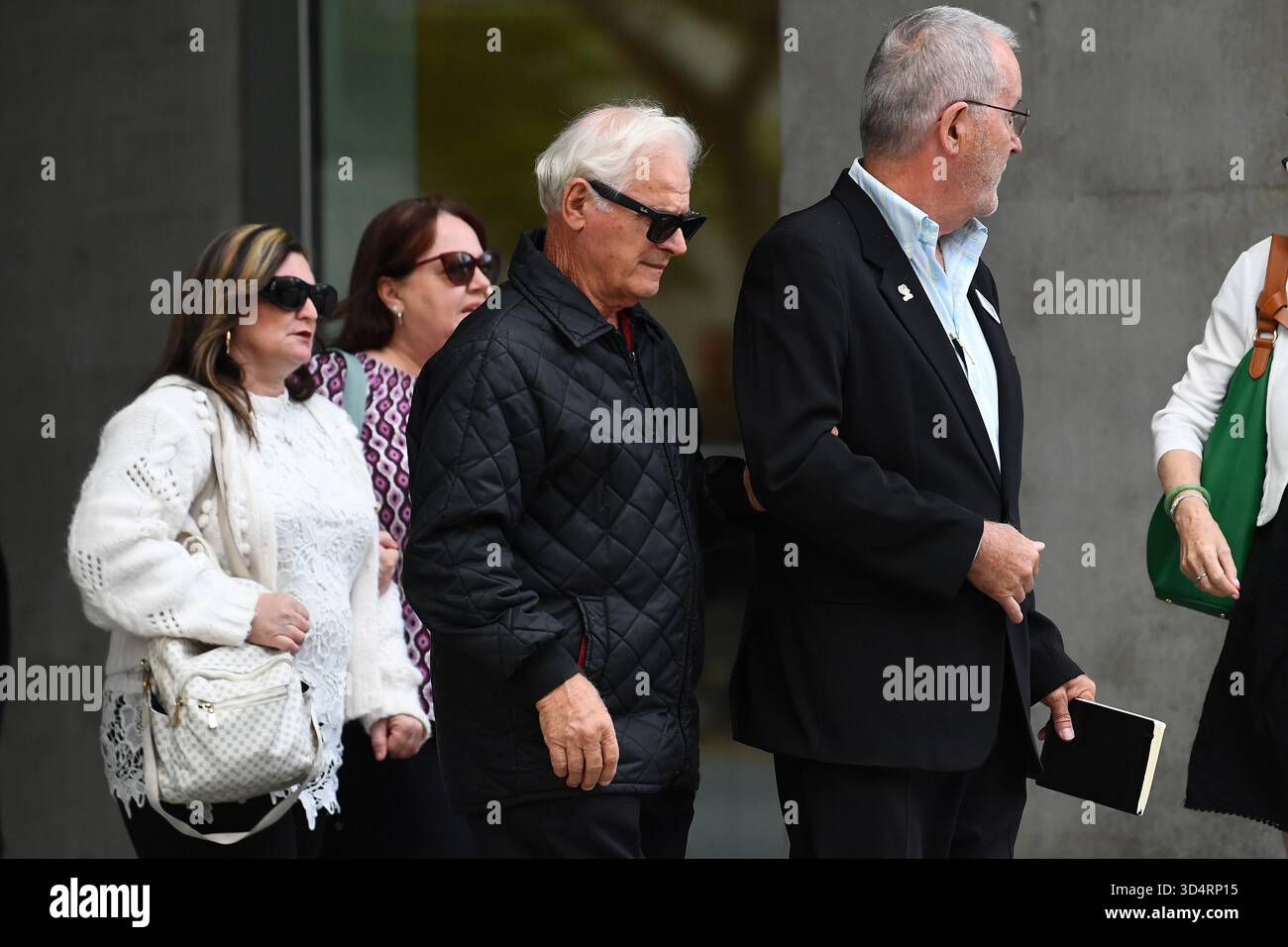 Victor White (middle) husband of Vyleen White, leaves the Brisbane ...