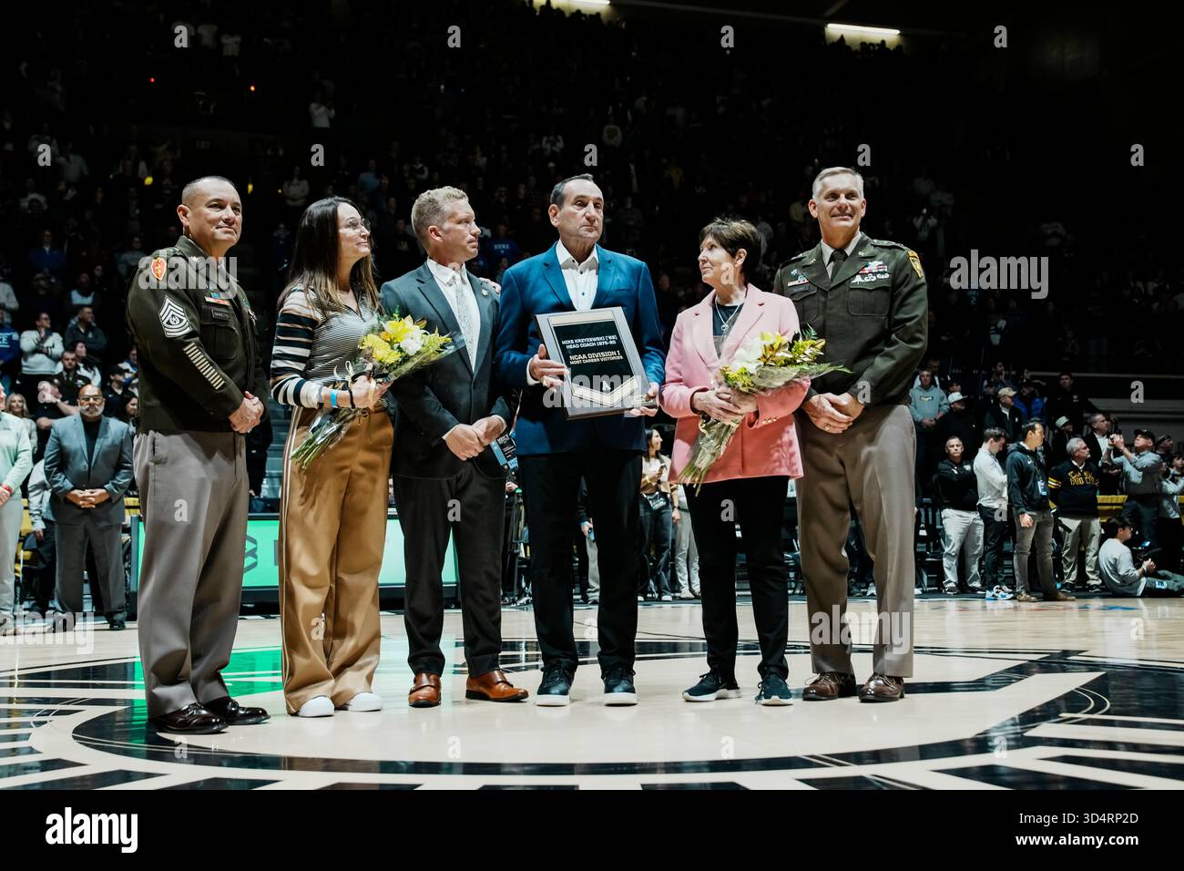 Former Duke coach Mike Krzyzewski, third right, poses for pictures ...