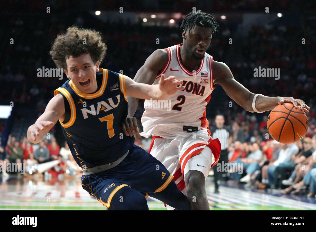 Arizona guard Dwayne Aristode gets fouled by Northern Arizona guard ...