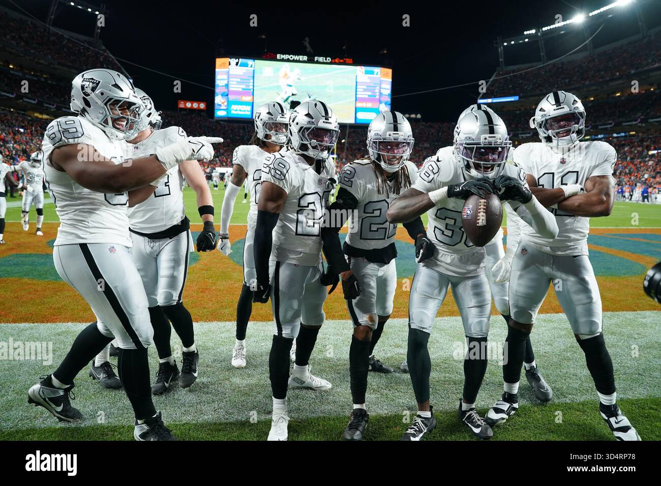 Las Vegas Raiders defensive celebrate a turnover against the Denver Broncos during an NFL ...
