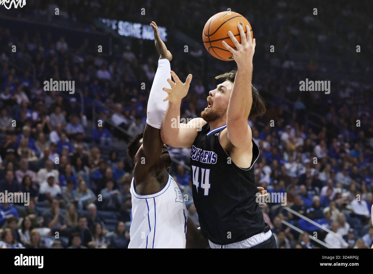 Delaware forward Tyler Houser shoots over BYU center Keba Keita during ...