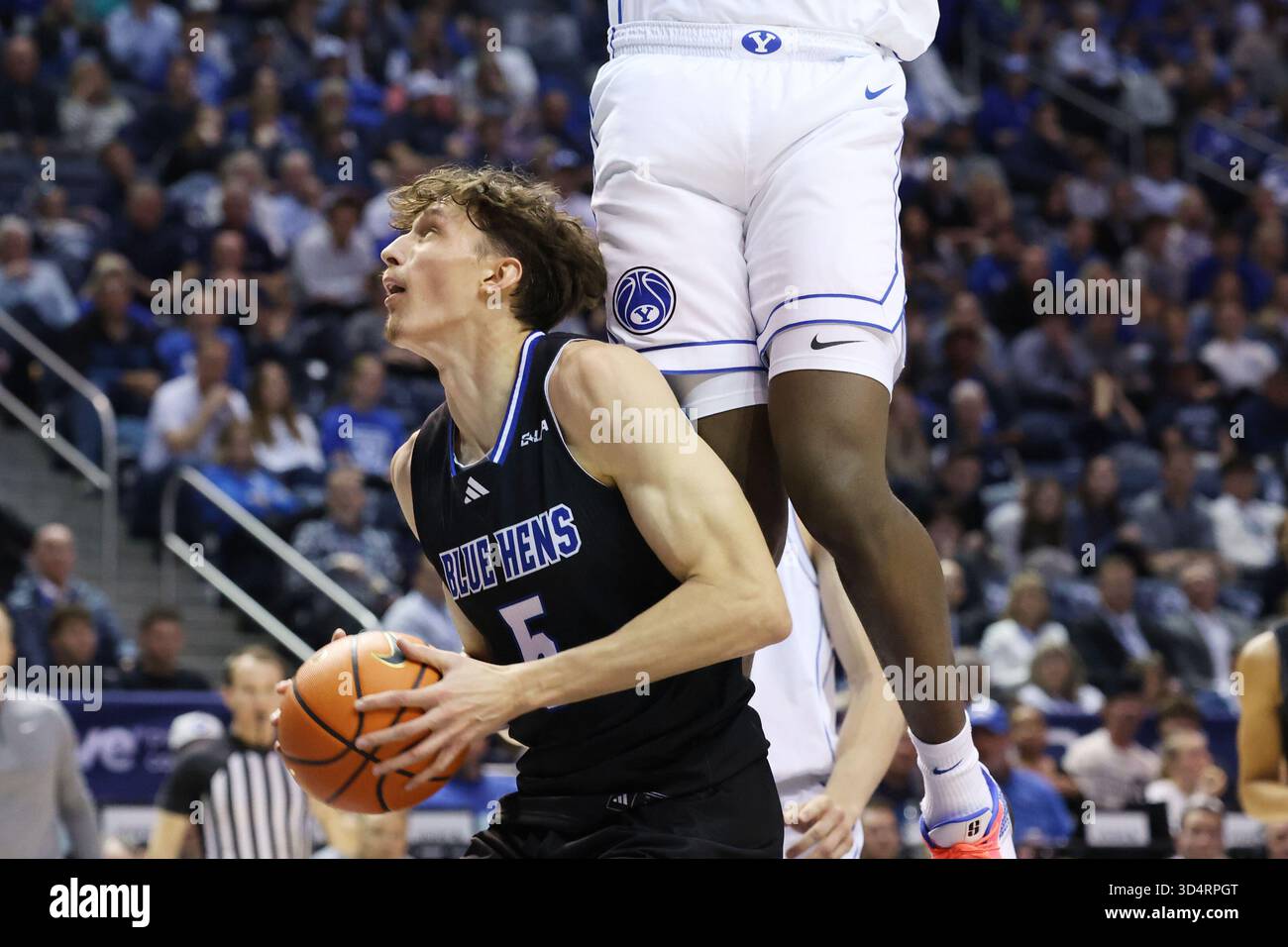 Delaware forward Macon Emory gets BYU forward AJ Dybantsa into the air ...