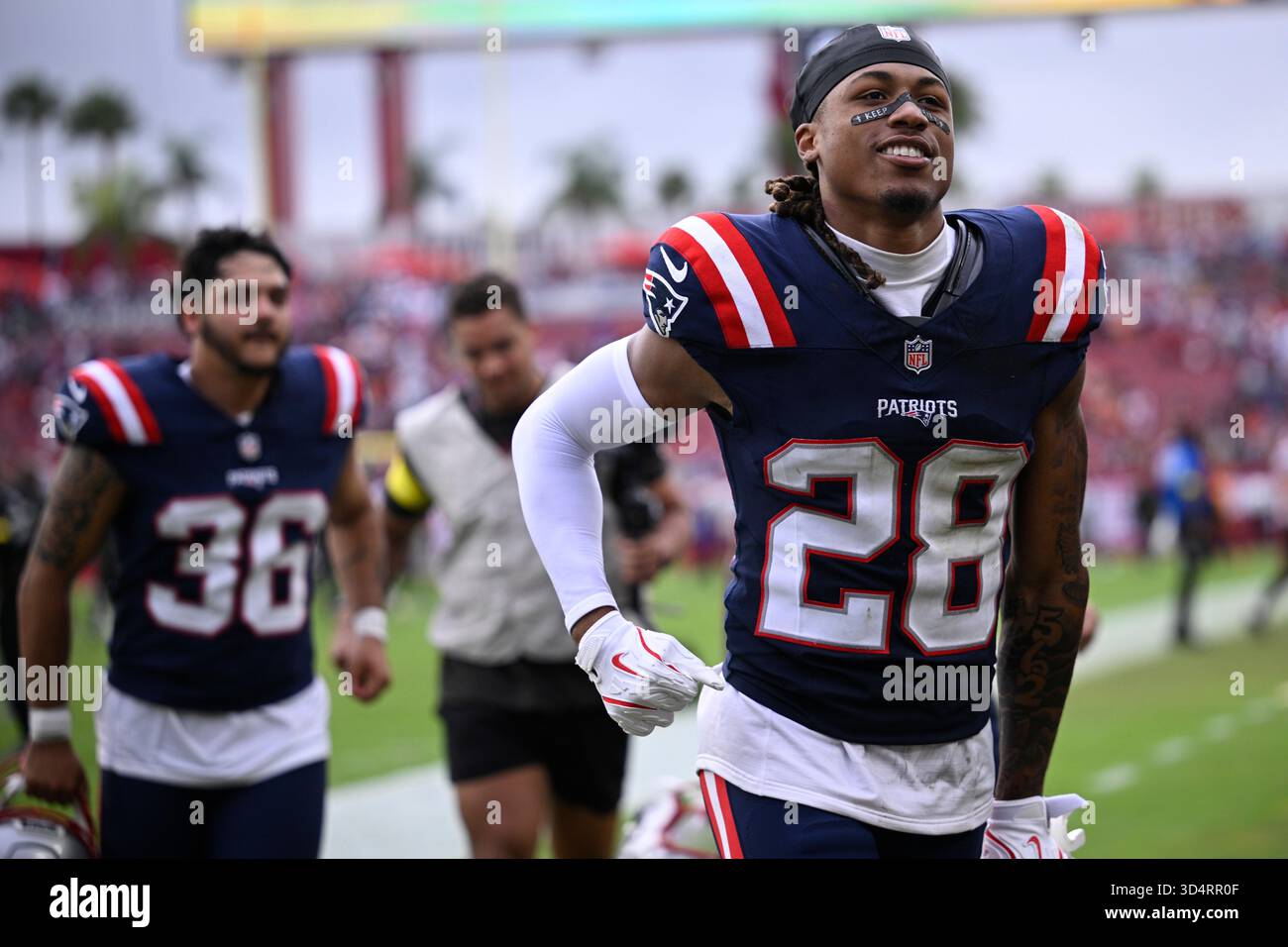 New England Patriots cornerback Alex Austin (28) leaves the field after ...