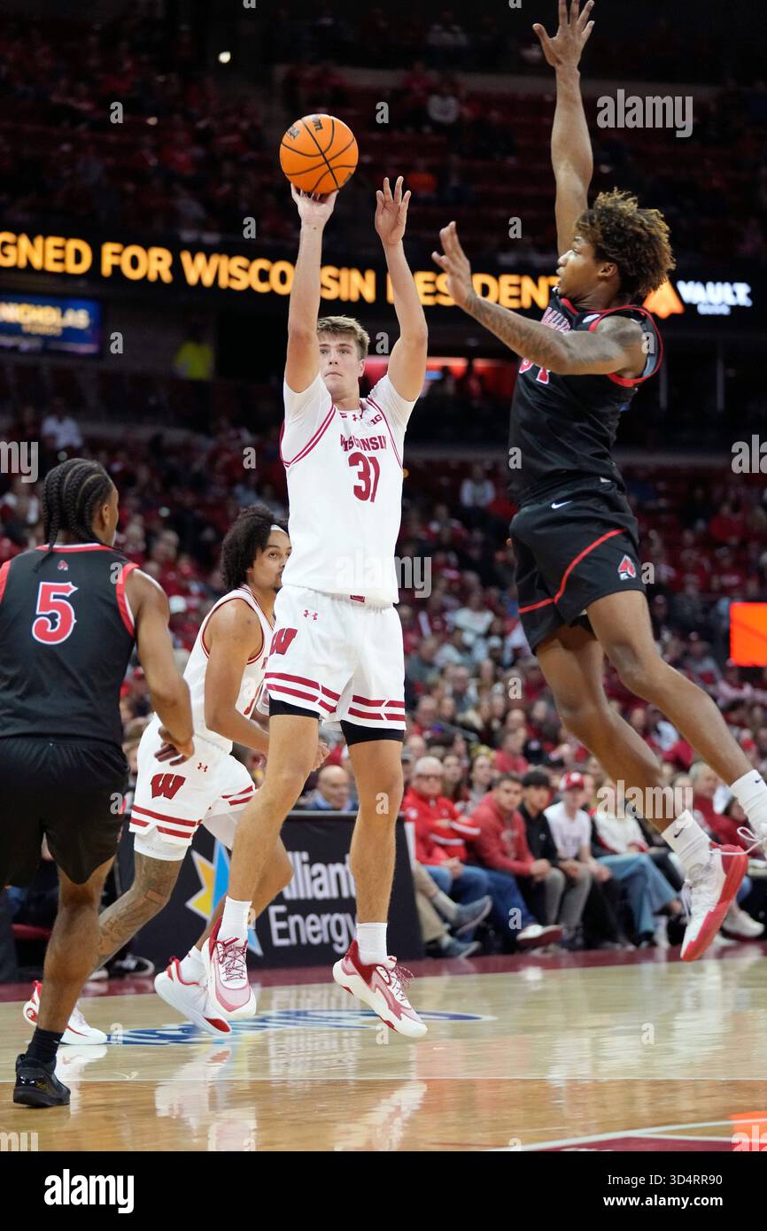 Wisconsin forward Nolan Winter (31) scores a three-point basket against ...