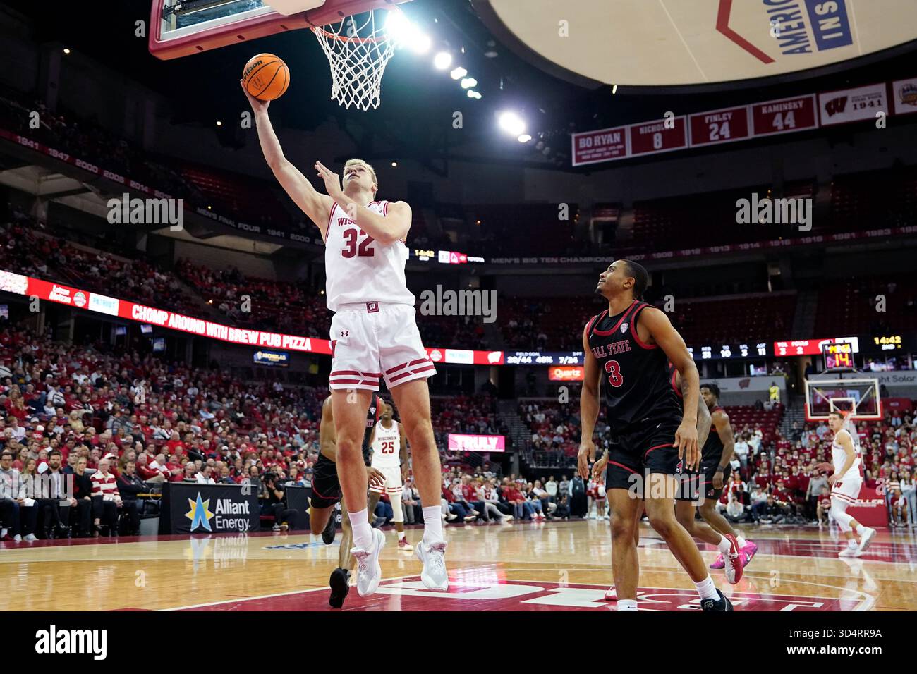 Wisconsin forward Aleksas Bieliauskas (32) scores against Ball State ...