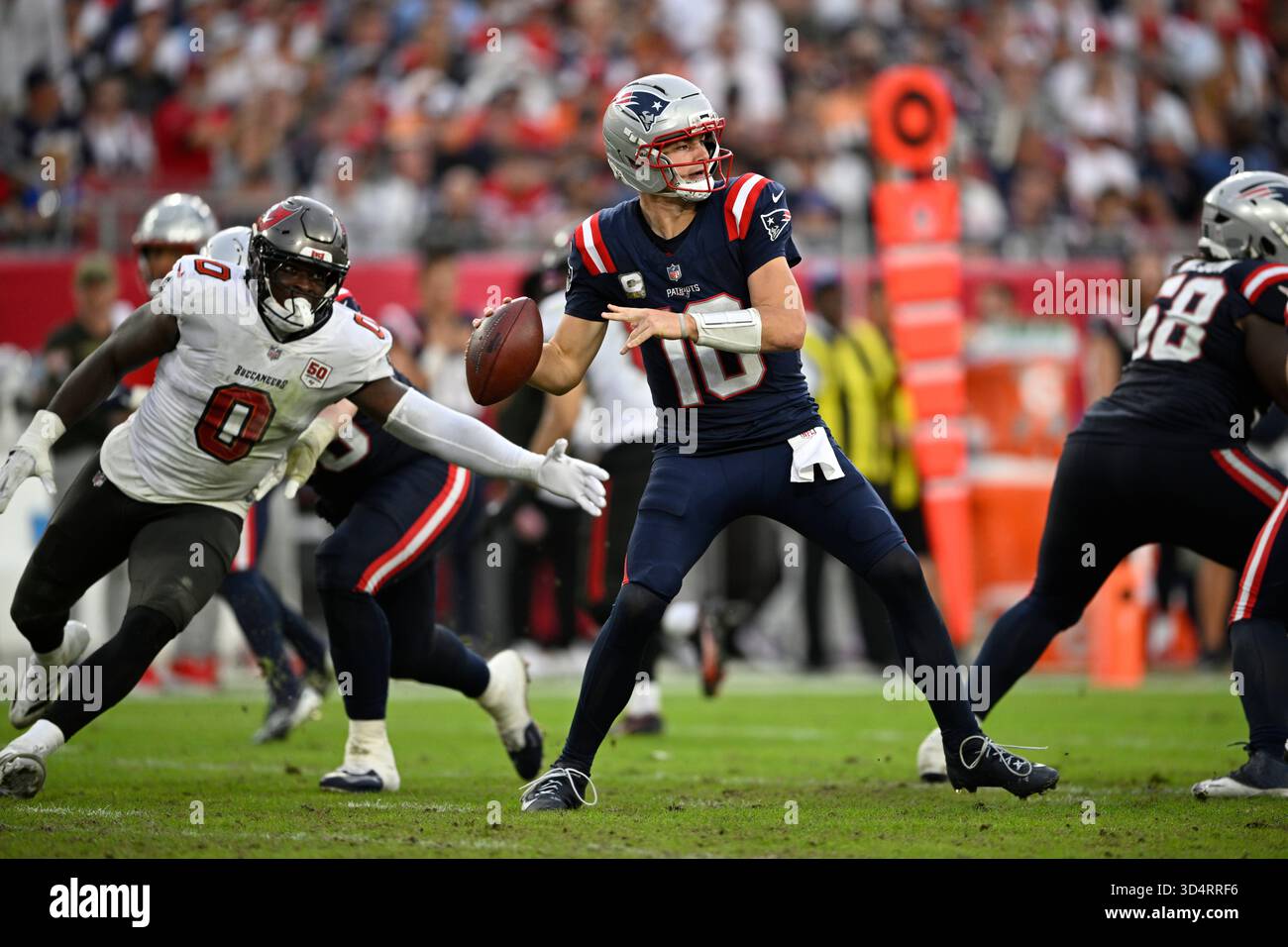 New England Patriots quarterback Drake Maye (10) throws a pass as Tampa ...