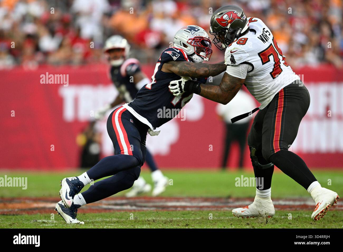 New England Patriots linebacker K'Lavon Chaisson, left, works against ...