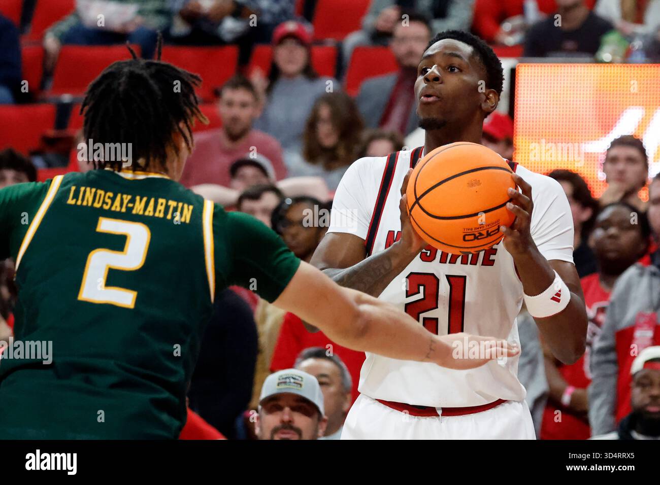 North Carolina State's Terrance Arceneaux (21) looks to pass the ball ...