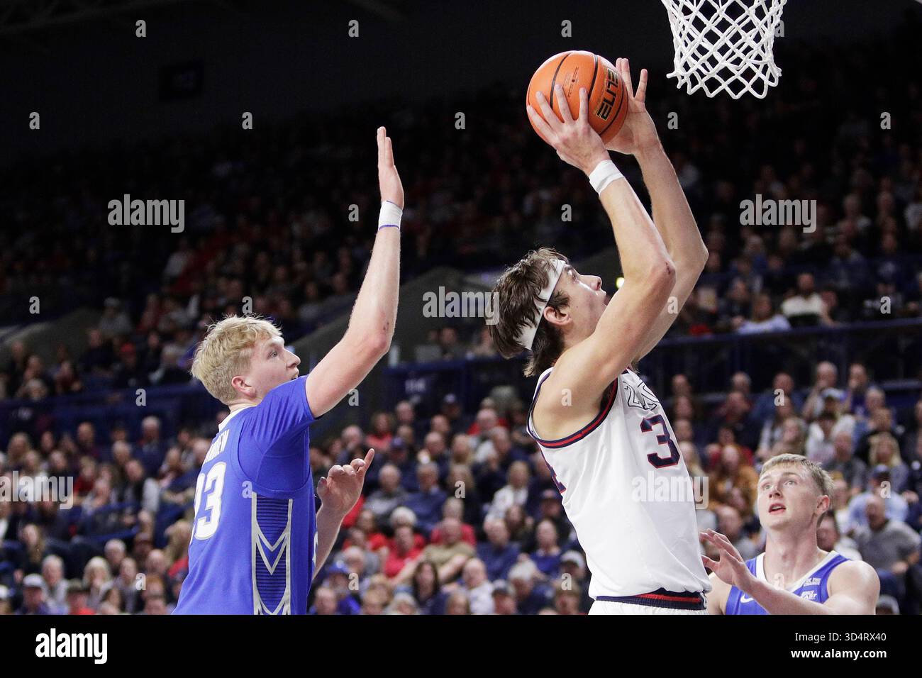 Gonzaga forward Braden Huff, right, shoots while pressured by Creighton ...