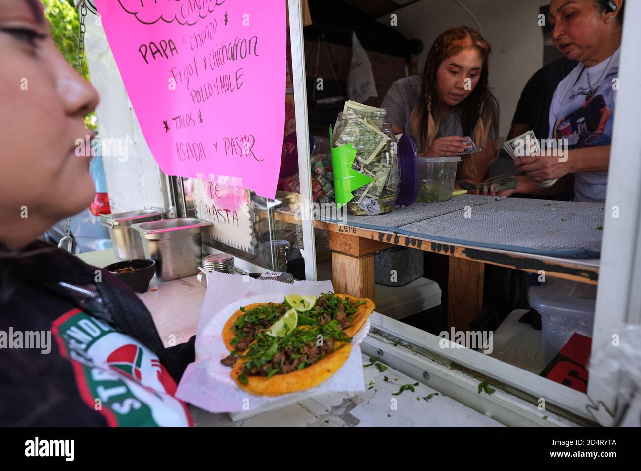 A street vendor Alicia Robles, right, and her daughter Yulisa Robles ...