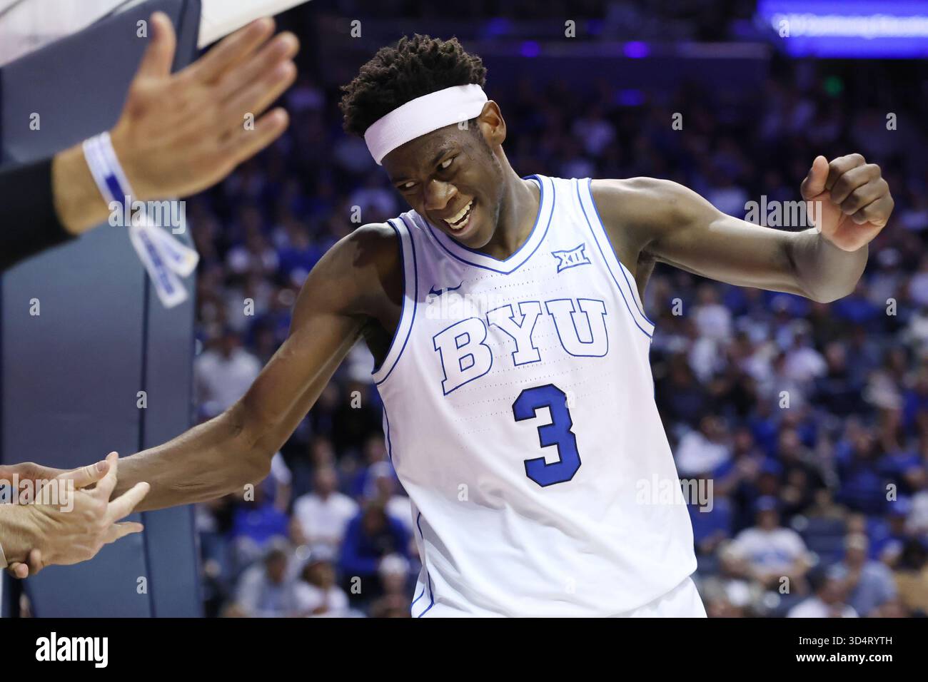 BYU forward AJ Dybantsa celebrates a dunk on Delaware with fans during ...