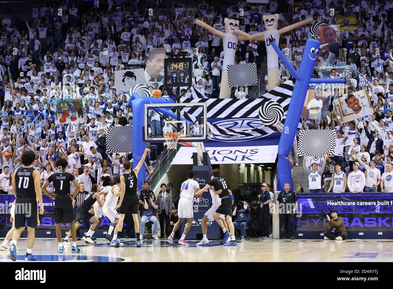 The BYU crowd shouts during a free throw in the second half of an NCAA ...