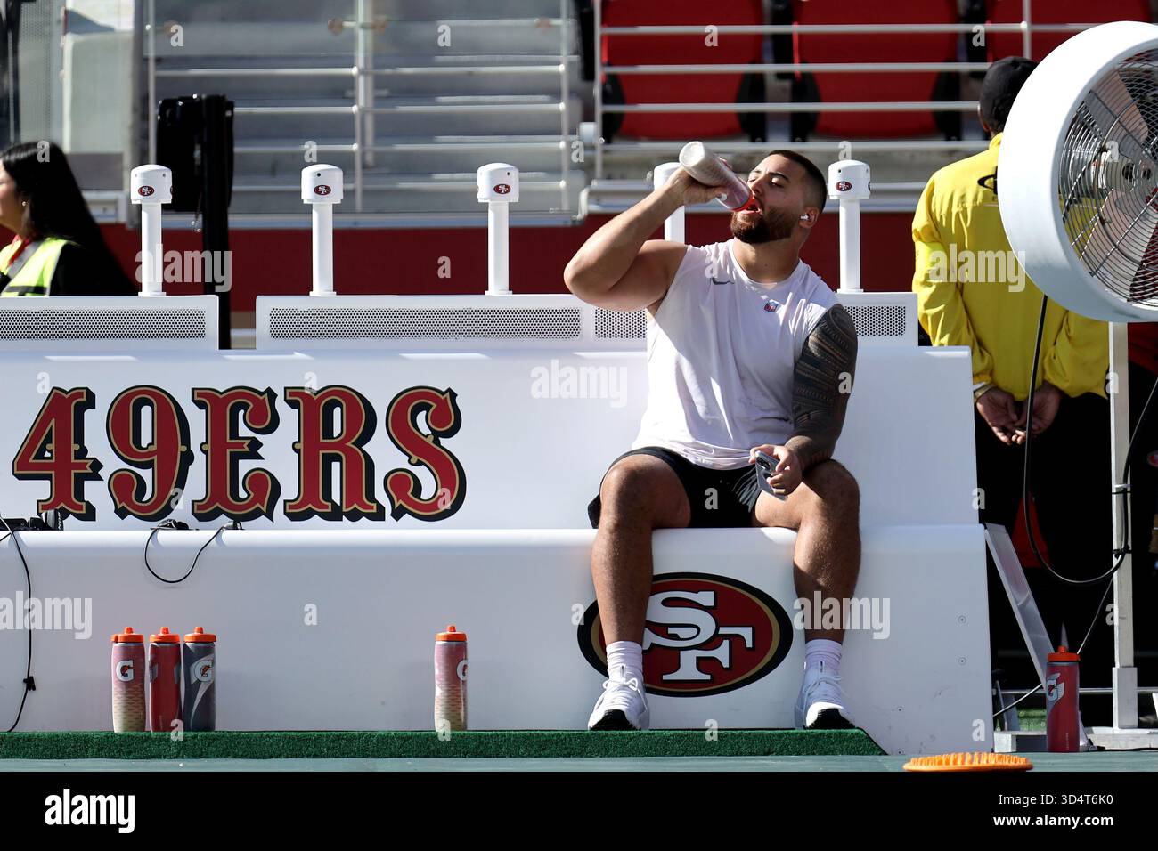 San Francisco 49ers offensive guard Dominick Puni (77) sits on a bench ...