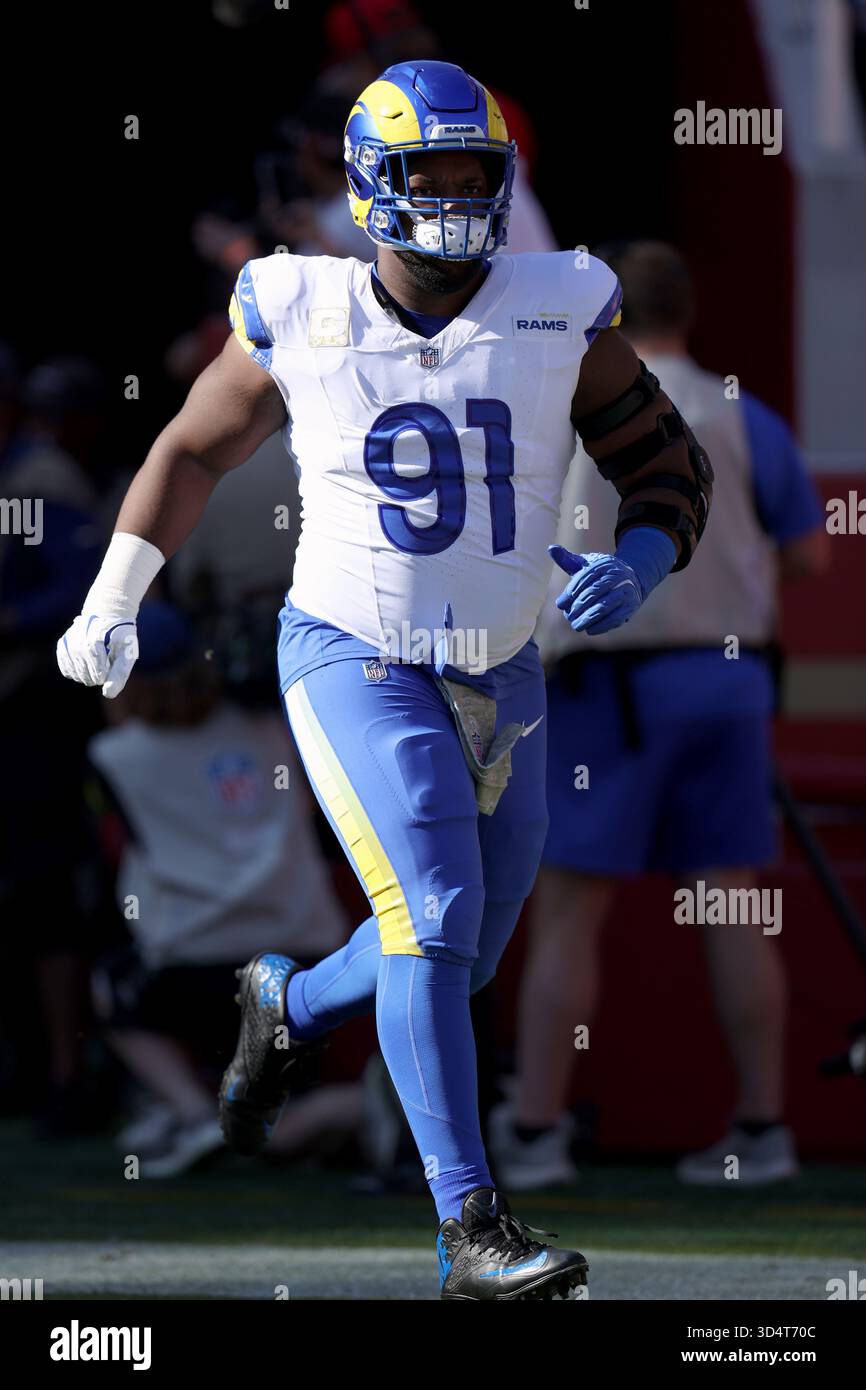 Los Angeles Rams defensive end Kobie Turner (91) runs onto the field ...