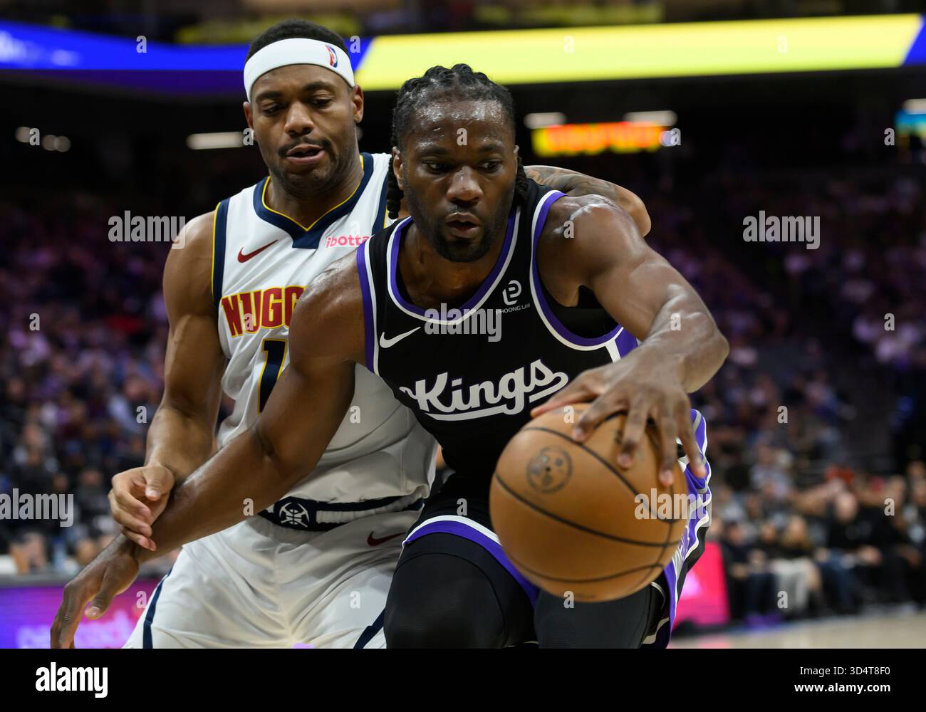 Sacramento Kings forward Precious Achiuwa, right is guarded by Denver ...