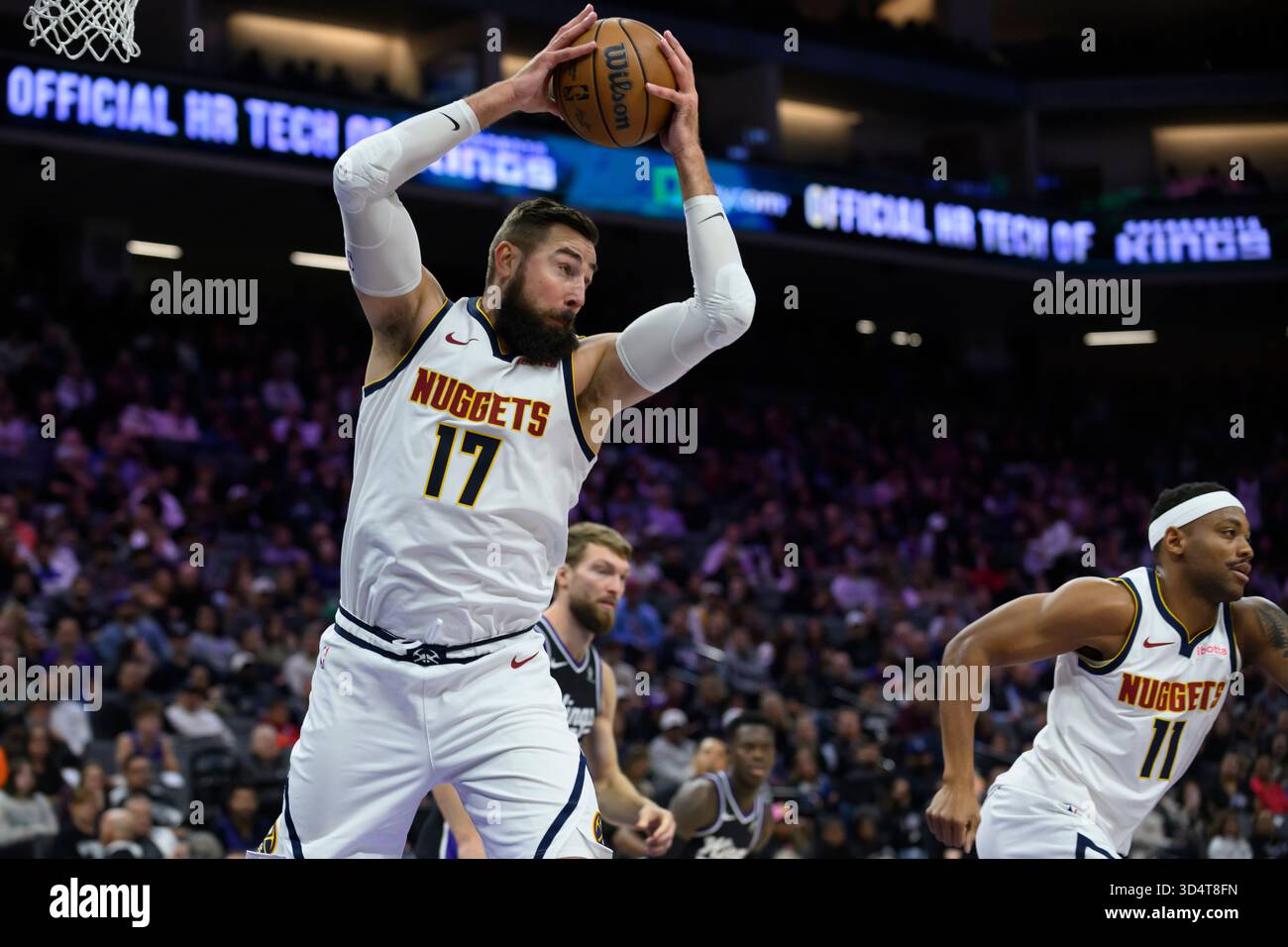 Denver Nuggets center Jonas Valančiūnas (17) pulls down a rebound ...