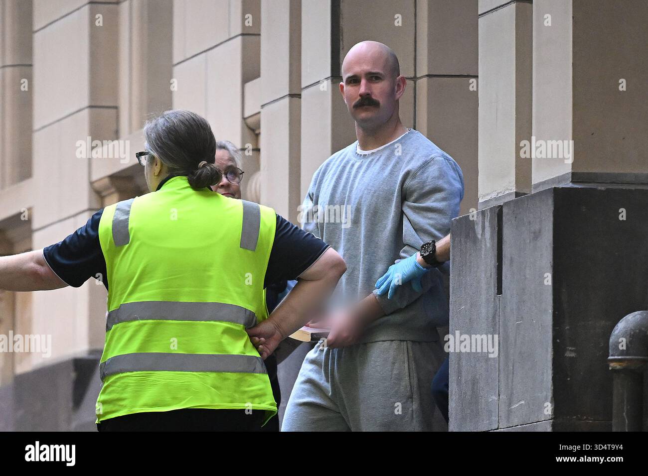 **EDS NOTE**IMAGE CONTAINS DIGITAL BLURRING**OBSCURING HANDCUFFS ...