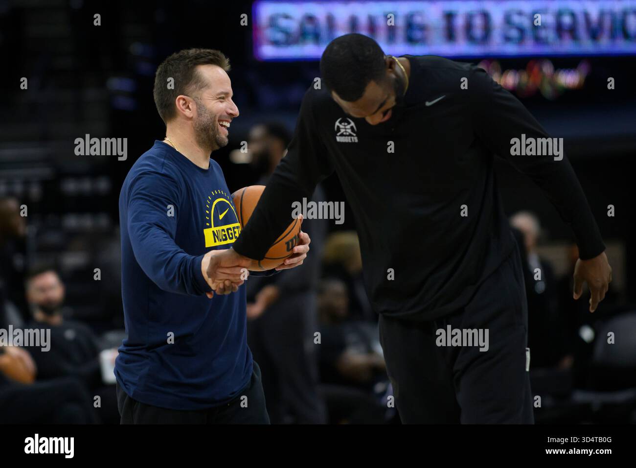 Denver Nuggets Assistant Coach JJ Barea, left, greets guard/forward Tim ...