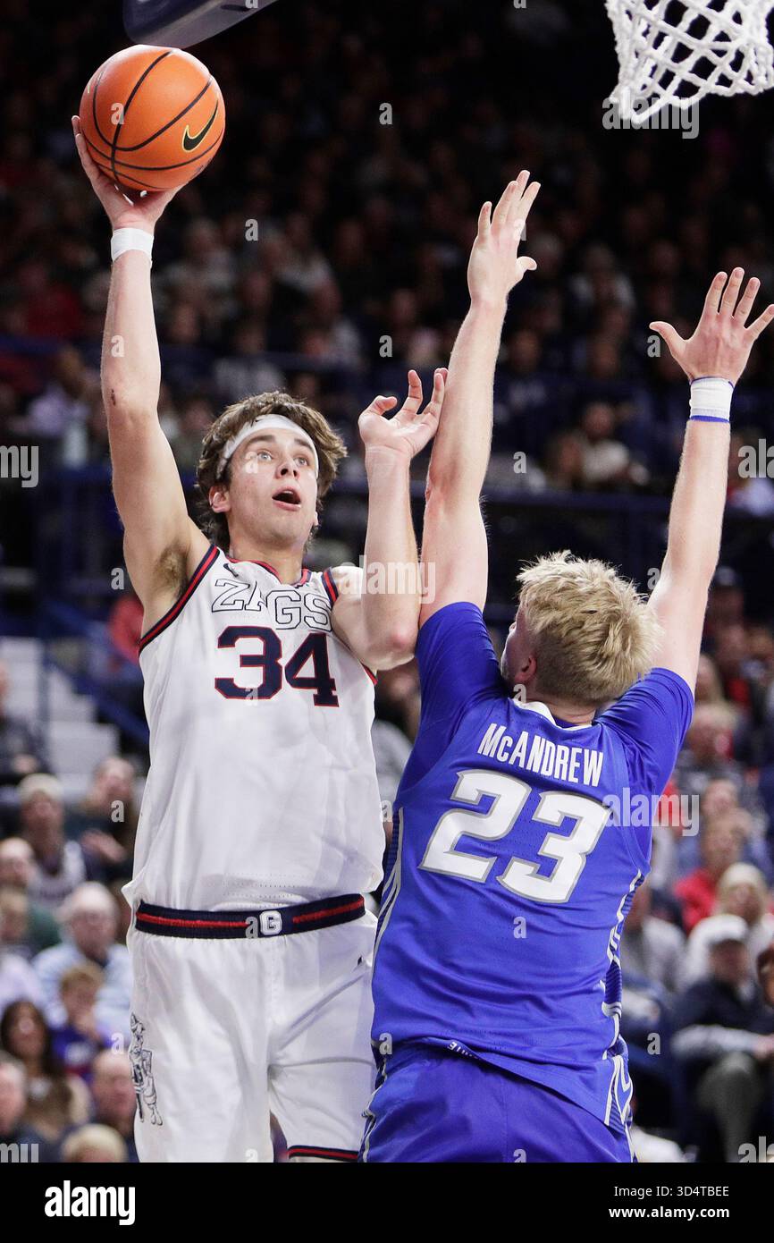 Gonzaga forward Braden Huff (34) shoots while pressured by Creighton ...