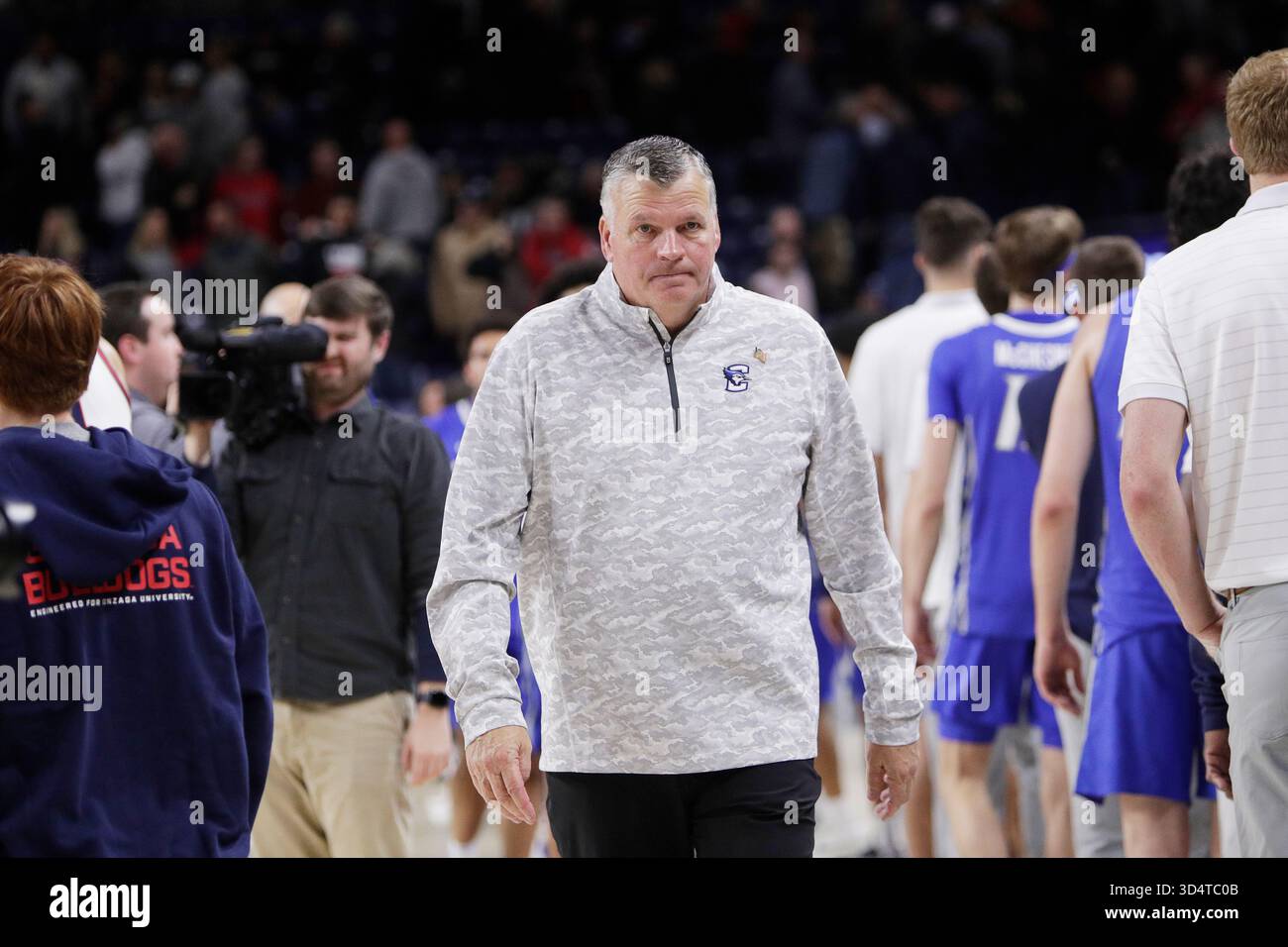 Creighton head coach Greg McDermott walks on the court after an NCAA college basketball game ...