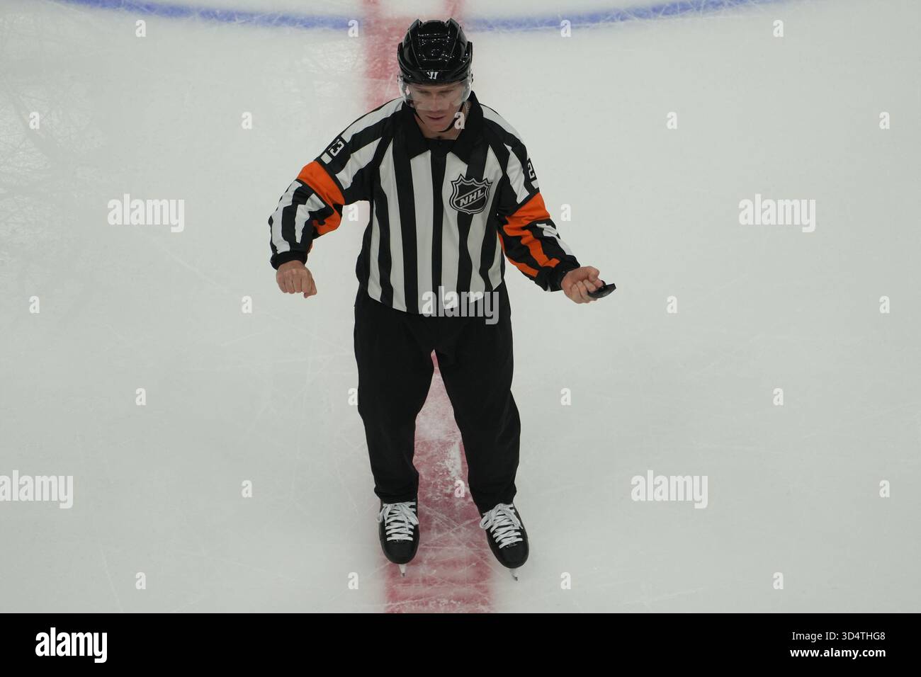 Referee Corey Syvret announces a cross checking penalty during the ...