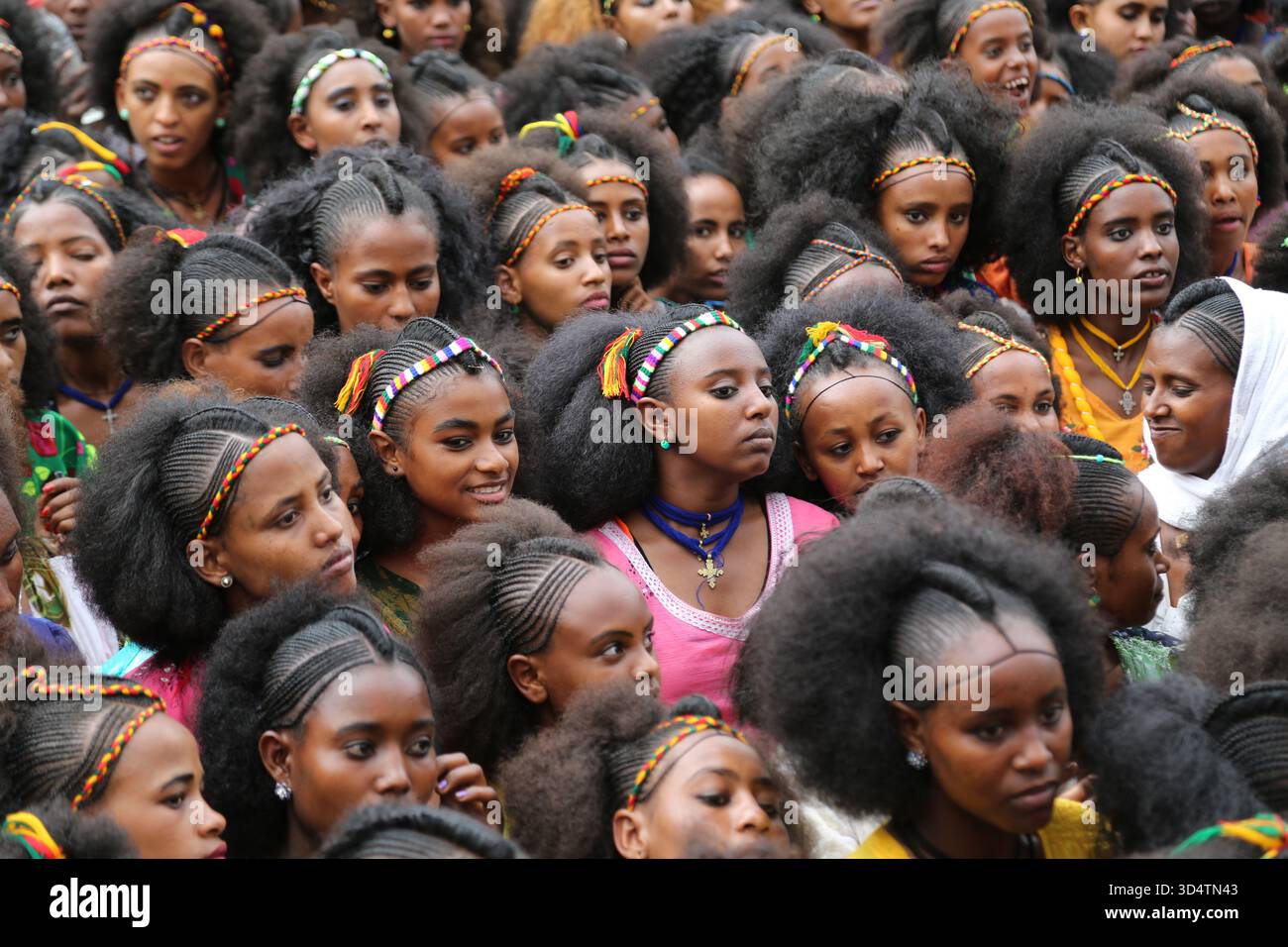 A group of joyful Tigrayan girls wearing traditional dresses and ...