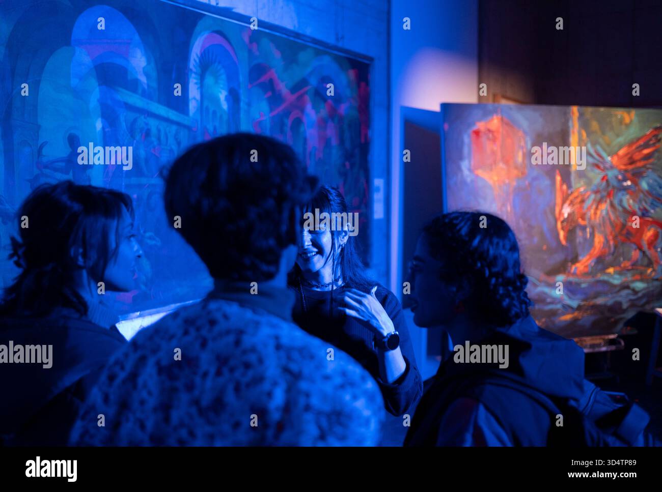 Young Iranian people speak with each other at an interactive art show ...